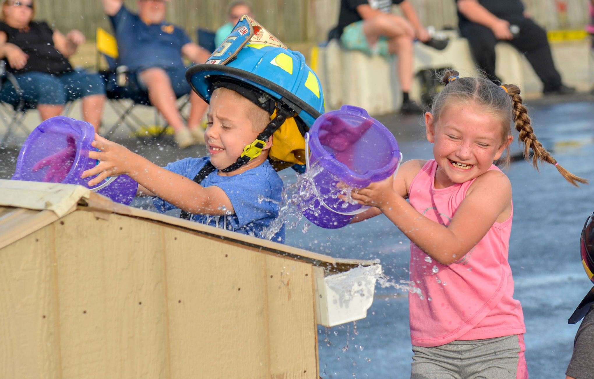 YOUTH BUCKET BRIGADE AT FIREFIGHTERS CONVENTION - Mon Valley Independent