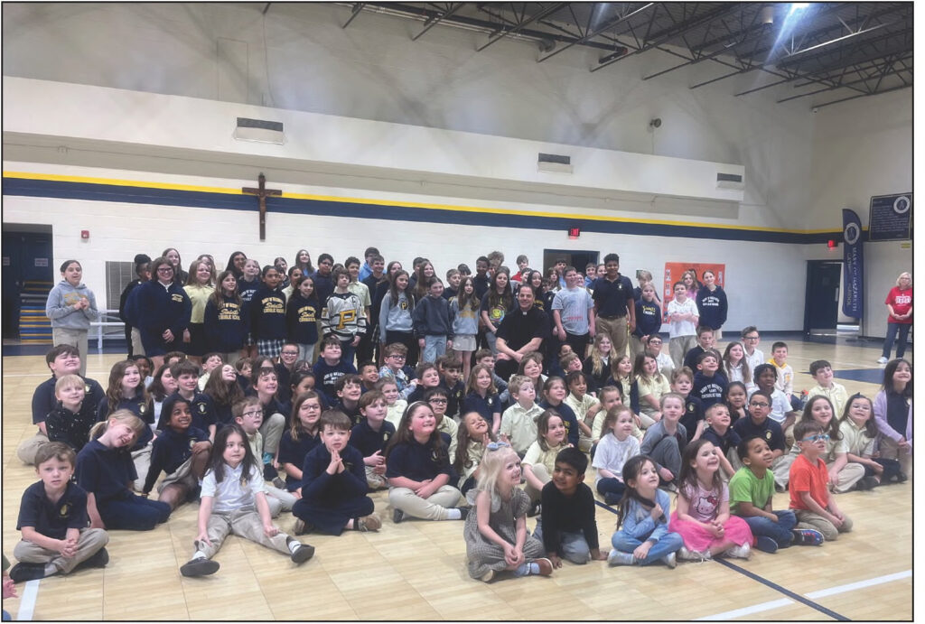 REV. BURKE HELPS PROMOTE READING - Mon Valley Independent