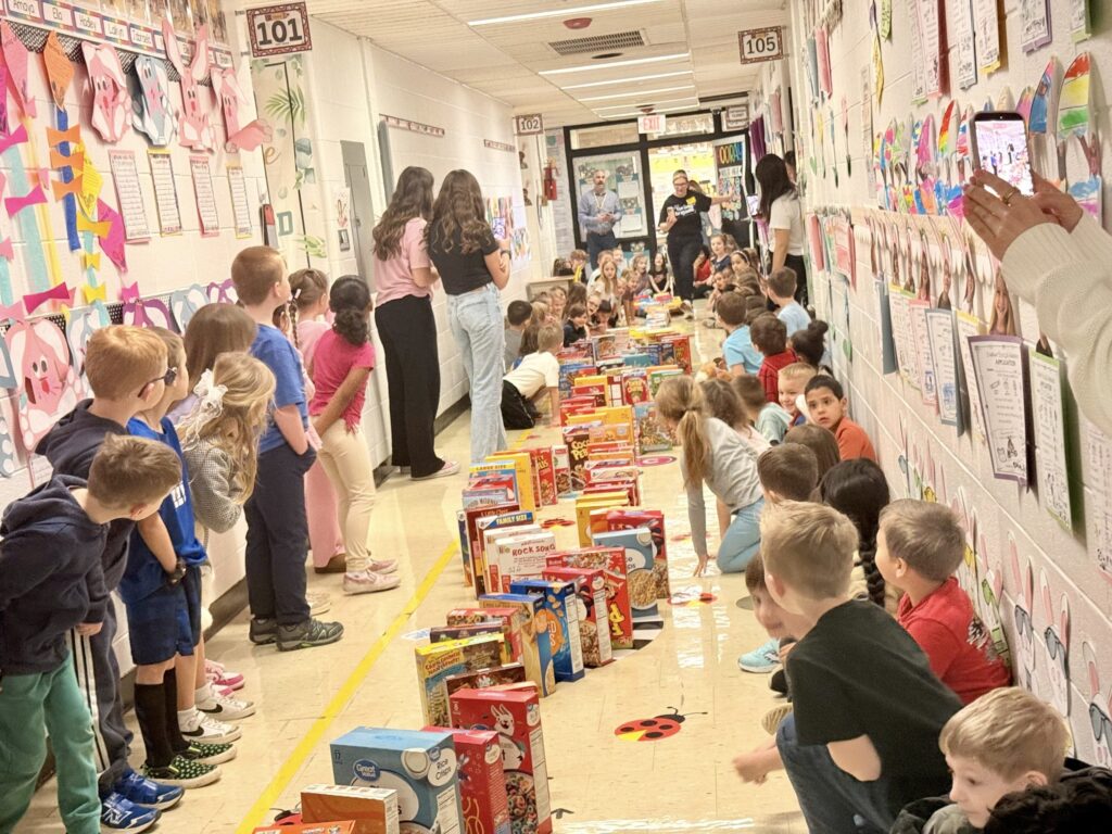 Students thrilled as cereal boxes topple in Bag Brigade event - Mon ...